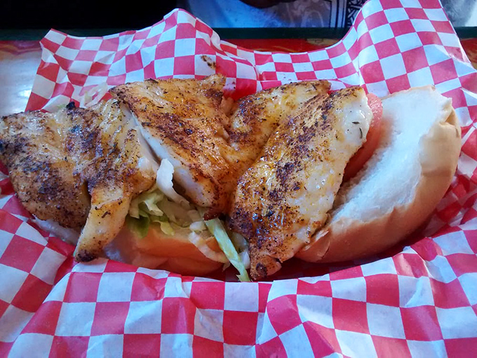 The blackened grouper sandwich arrives like a celebrity on a red-checkered carpet. One bite and you'll understand why people cross county lines for this.