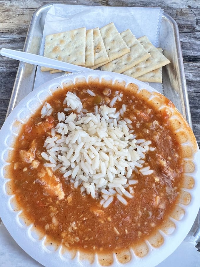 This isn't just gumbo &ndash; it's a warm Gulf hug in a bowl. That rice island floating in seafood-rich waters tells you everything about priorities here.