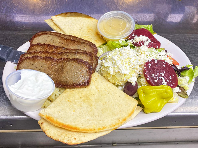 The Greek Platter arrives like a Mediterranean vacation on a plate &ndash; complete with pita bread and enough feta to make Zeus proud.