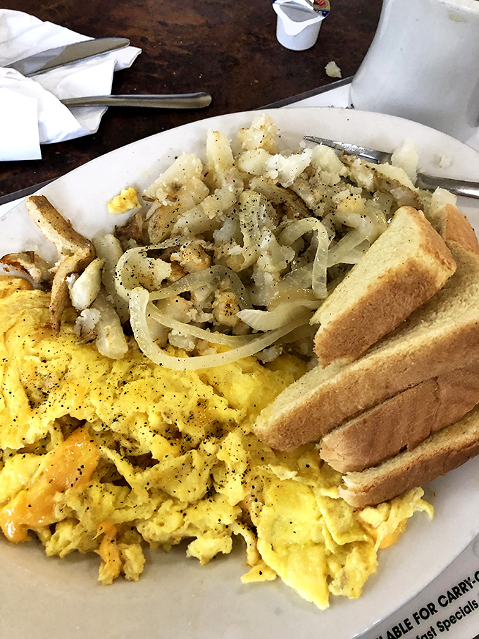 Home fries that achieve the impossible balance of crispy edges and tender centers, playing the perfect supporting role to those sunshine-yellow eggs.