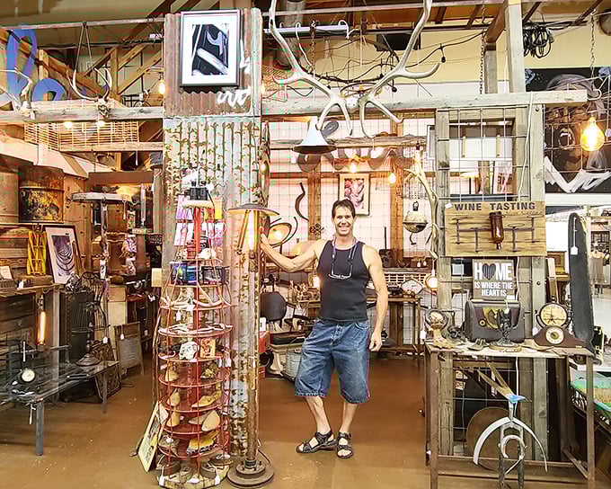 Vendor booths create a delightful maze of discovery. This industrial-meets-rustic corner showcases everything from vintage lighting to repurposed treasures.