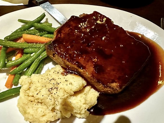 This meatloaf doesn't apologize for being comfort food; it celebrates it with a glossy sauce that makes you want to call your mother and apologize for liking this better.