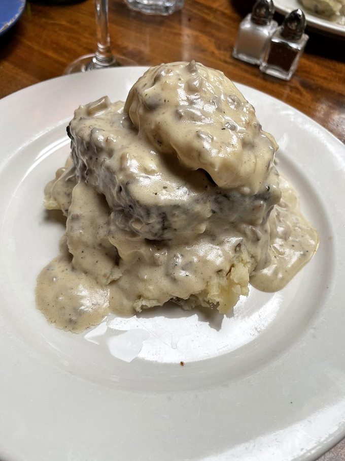 This isn't your grandmother's meatloaf&mdash;it's a towering monument to comfort food elevated to art form, smothered in mushroom gravy.