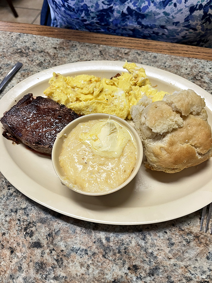 This isn't just meatloaf – it's a masterclass in comfort. Perfectly seared, served with fluffy eggs, grits, and a biscuit that could make a Southerner weep.