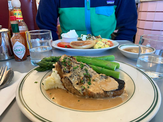 This isn't just meatloaf&mdash;it's a savory monument to comfort, bathed in rich gravy and flanked by asparagus soldiers standing at attention.