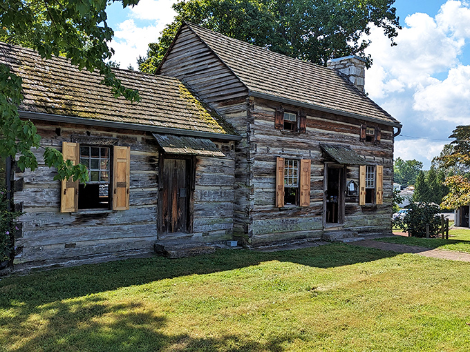 This lovingly preserved log cabin at the Crockett Tavern Museum whispers stories of frontier life, when "roughing it" wasn't a weekend choice but a daily reality.