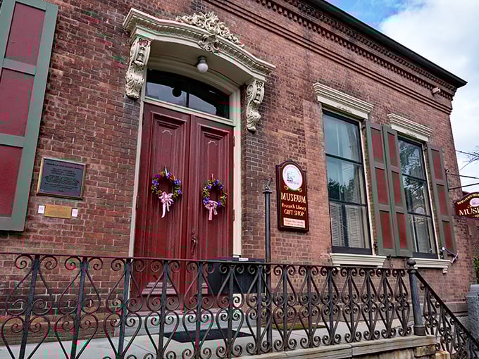 This isn't just any brick building—it's the Wayne County Historical Society Museum, where Honesdale's past is preserved behind those magnificent burgundy doors.