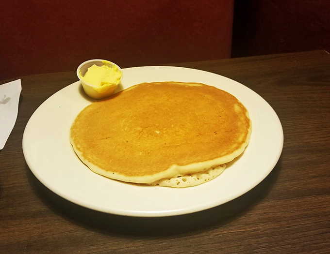 Golden perfection in circular form. This pancake doesn't need fancy accessories&mdash;just a sidekick of butter waiting to melt into every fluffy pore.