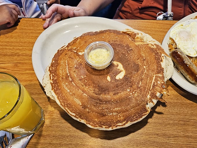 Behold the pancake in its natural habitat&mdash;golden-brown, perfectly round, with a puddle of melting butter crowning this breakfast royalty.