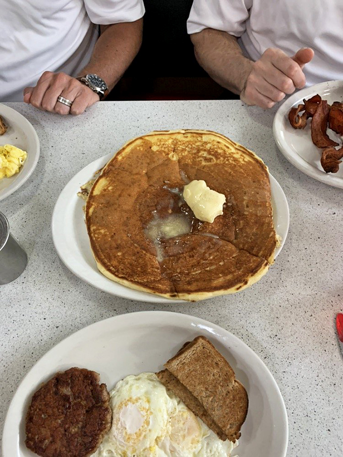 The legendary pancake in its natural habitat &ndash; golden-brown, butter-melting perfection that makes you question why you'd eat pancakes anywhere else.