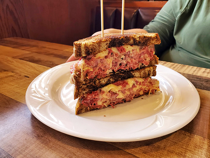 This sandwich isn't just stacked&mdash;it's architected. Layers of pink corned beef and melted cheese create a skyscraper of deliciousness worth every napkin.