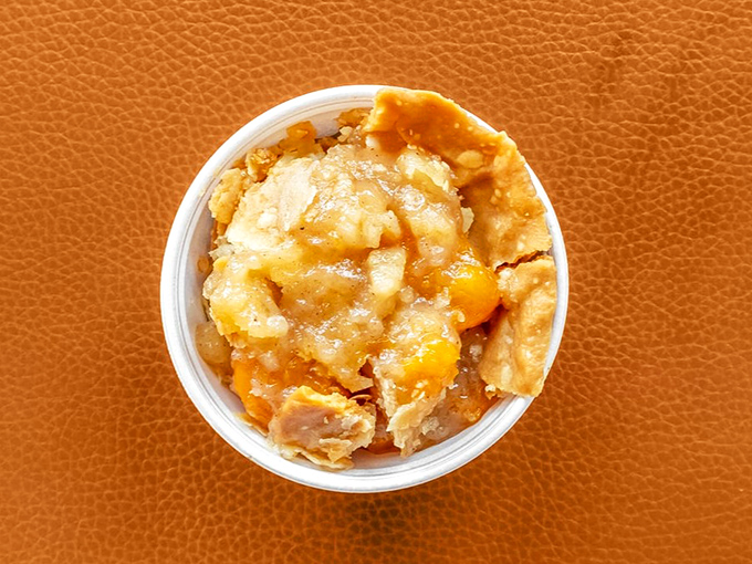 Georgia's state fruit transformed into something so heavenly it should require a permission slip. This isn't just cobbler; it's edible sunshine.