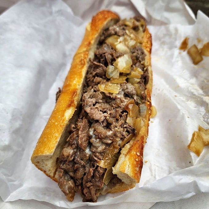 The holy grail of Philadelphia sandwiches. Perfectly chopped ribeye, caramelized onions, and melted cheese nestled in that legendary house-baked roll&mdash;worth every minute in line.