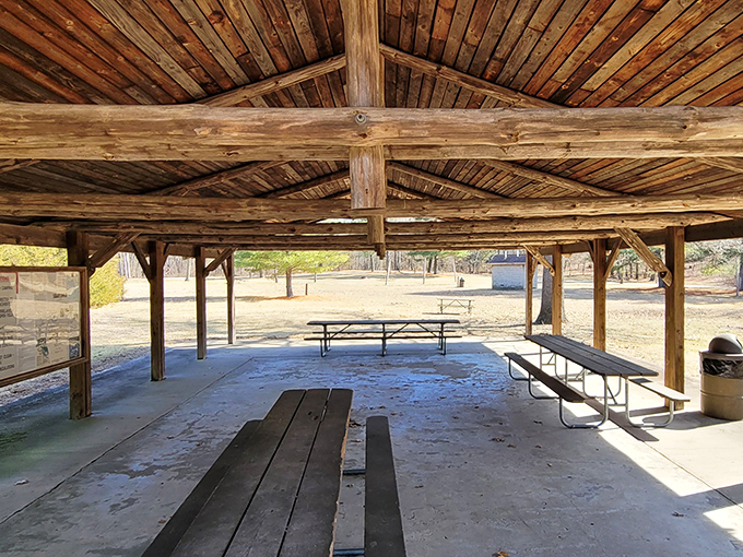 This rustic picnic shelter has hosted more family memories than a Thanksgiving dinner table. Simple wooden beams frame possibilities for outdoor feasts.