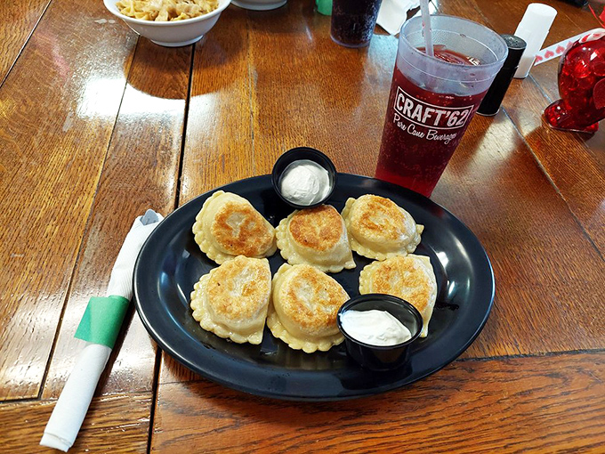 Golden-brown pockets of joy, perfectly saut&eacute;ed and served with the holy trinity of pierogi accompaniments: sour cream, more sour cream, and did I mention sour cream?