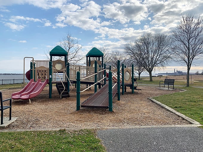 Childhood joy engineered in green and purple. This playground proves you're never too old to feel a twinge of slide-envy.