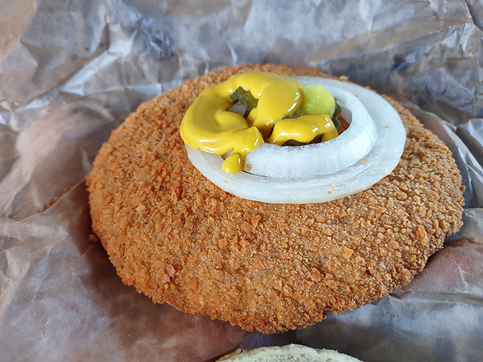 Behold the pork tenderloin in its natural habitat&mdash;a golden-brown disk of deliciousness that makes its bun look like it's suffering from an inferiority complex.