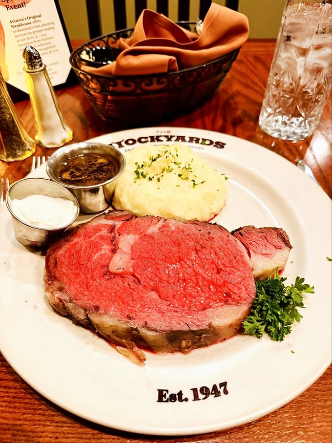 The prime rib arrives like royalty—pink, tender, and accompanied by sides that know their supporting role in this meat-centric drama.