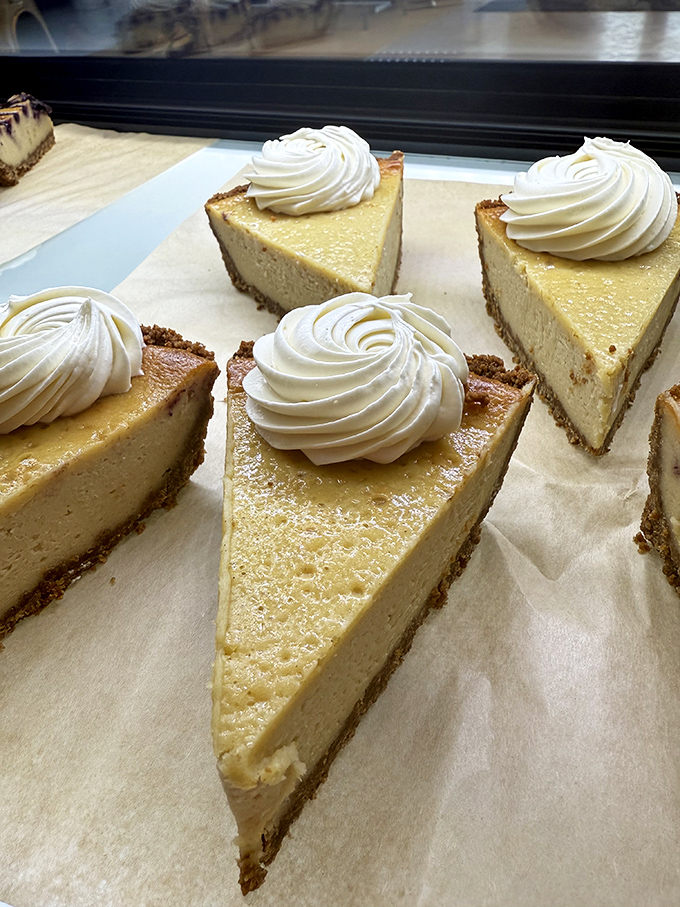 Vegan cheesecake so convincing it should come with ID. That perfect swirl of cream atop golden filling would make any New York deli owner do a double-take.