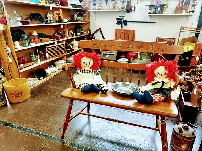 These vintage Raggedy Ann dolls aren't just toys&mdash;they're childhood memories sitting patiently on an antique bench, waiting for someone to remember them.