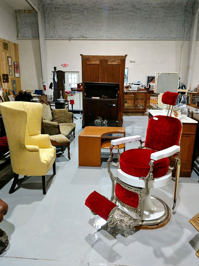 That magnificent red barber chair isn't just vintage furniture &ndash; it's a throne where countless men once contemplated life while getting the perfect trim.