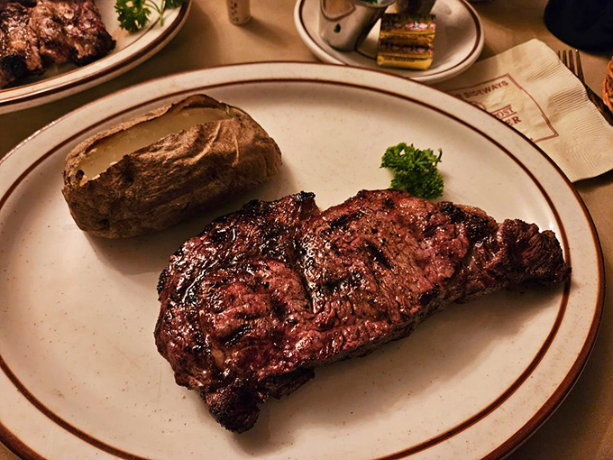Behold the star of the show: a perfectly charred ribeye with those gorgeous grill marks that whisper, "This is why you came here."
