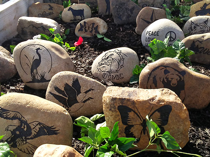 Stone canvas masterpieces that bring the outdoors indoors. Each hand-painted rock tells a story, from majestic wildlife to peace signs that never went out of style.