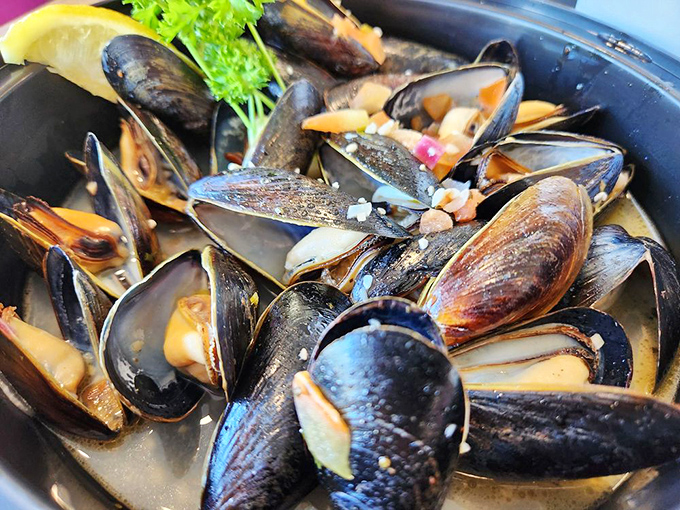 These mussels aren't just flexing for show. Plump, tender, and swimming in garlicky goodness that demands bread for sopping.