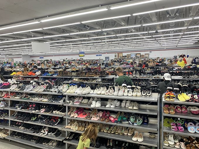 A footwear fantasyland stretching to the horizon. Finding your size is like winning a mini lottery, except the jackpot is comfy shoes with someone else's perfectly good taste.