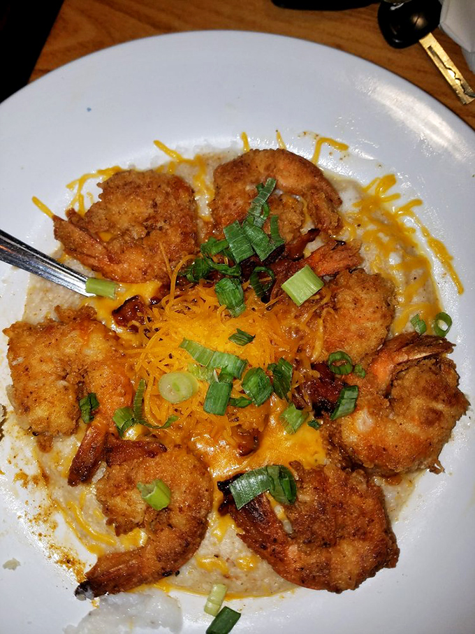 These shrimp and grits aren't just a dish&mdash;they're a Southern hug on a plate, with each golden morsel surrounded by cheesy goodness that would make even a grits skeptic swoon.