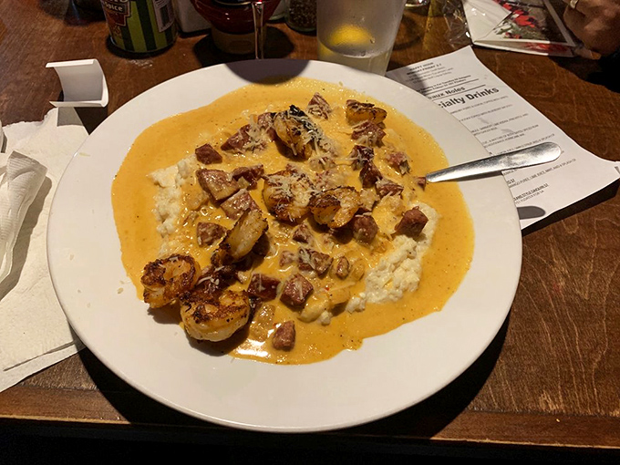 Behold the legendary shrimp and grits &ndash; creamy perfection topped with plump Gulf shrimp and Andouille in a sauce that's brought grown adults to tears of joy.