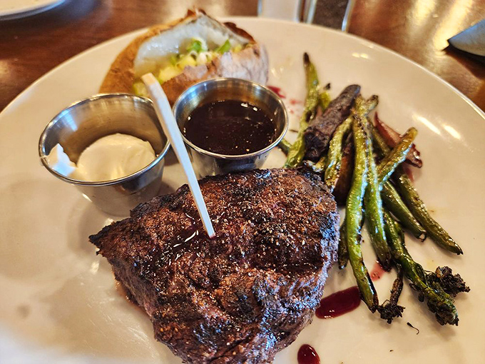 Behold the star of the show! This perfectly seared sirloin with its crusty exterior and juicy center makes vegetarians question their life choices.