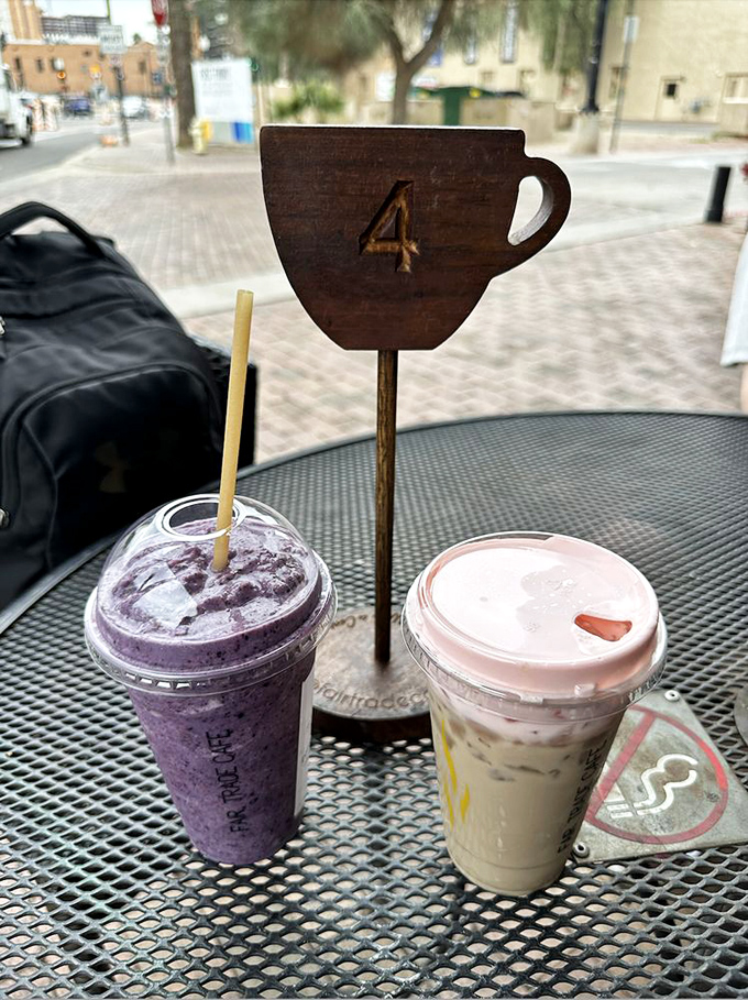 Table number 4 stands guard over purple and creamy concoctions that make you wonder if smoothies deserve their own zip code.