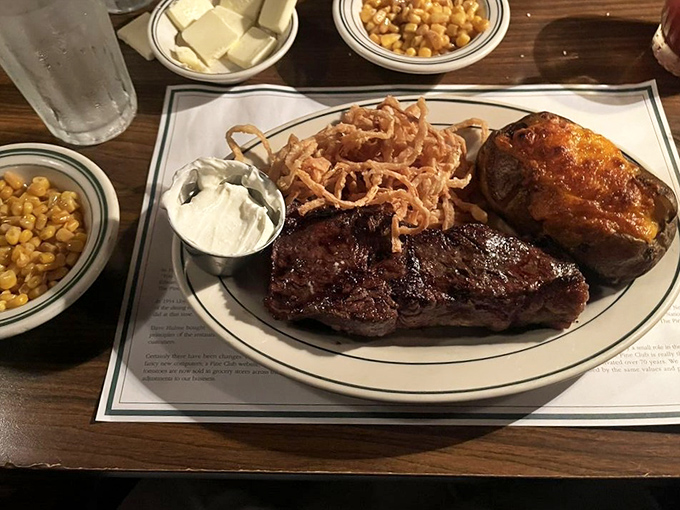 This isn't just a steak; it's a masterclass in simplicity&mdash;perfectly seared beef alongside those famous onion rings and stewed tomatoes.