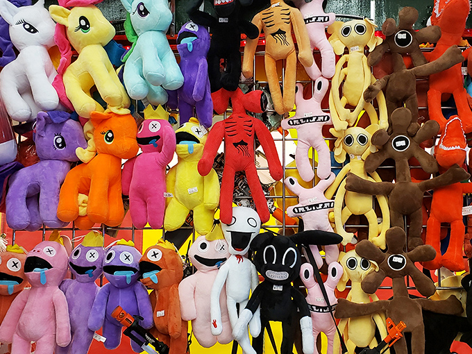 Plush paradise! Where else can you find a rainbow army of stuffed companions that would make even the most serious adult consider adopting a neon unicorn?