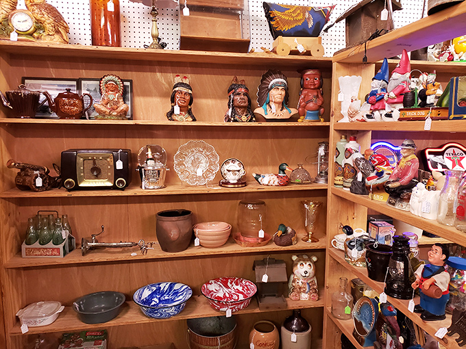 Native American figurines sharing shelf space with vintage kitchenware &ndash; where cultural history and domestic nostalgia create unexpected harmony.