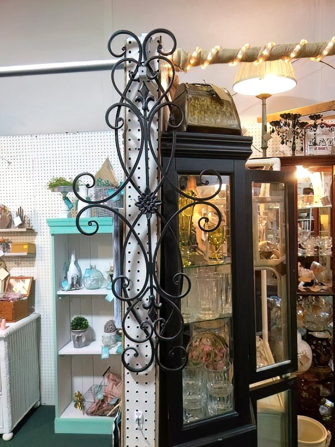 Wrought iron meets vintage elegance in this display where form and function dance together like Fred and Ginger.