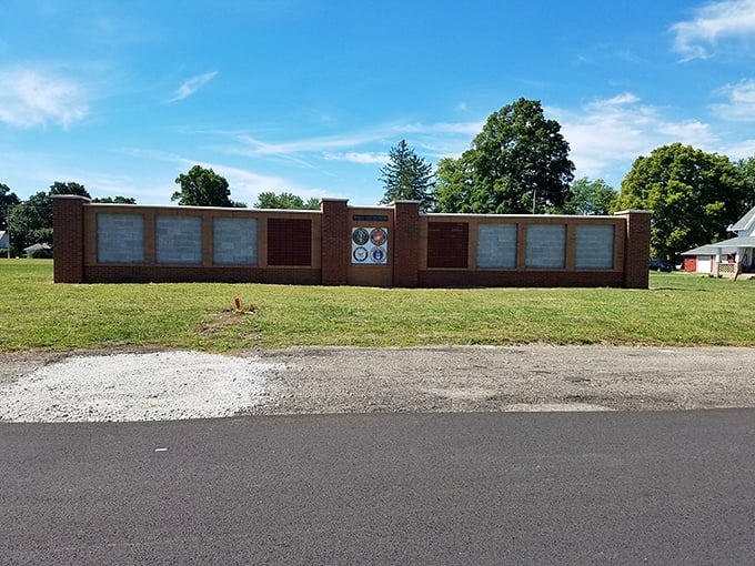 History etched in brick. This memorial wall honors Utica's heritage and those who shaped it, standing as a testament to the community's deep roots.