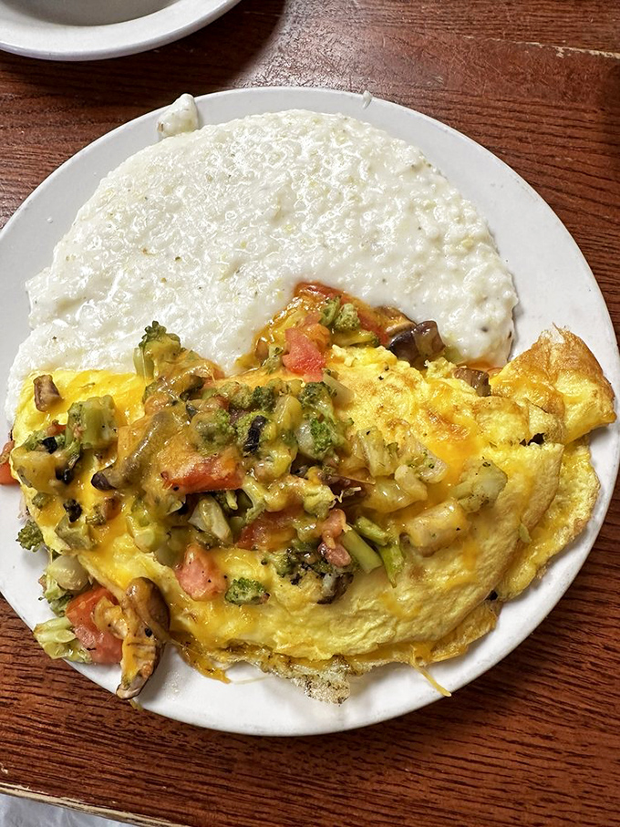 This vegetable-packed omelet with creamy grits proves healthy-ish can still be delicious. The cheese pulls like it's auditioning for a food commercial.