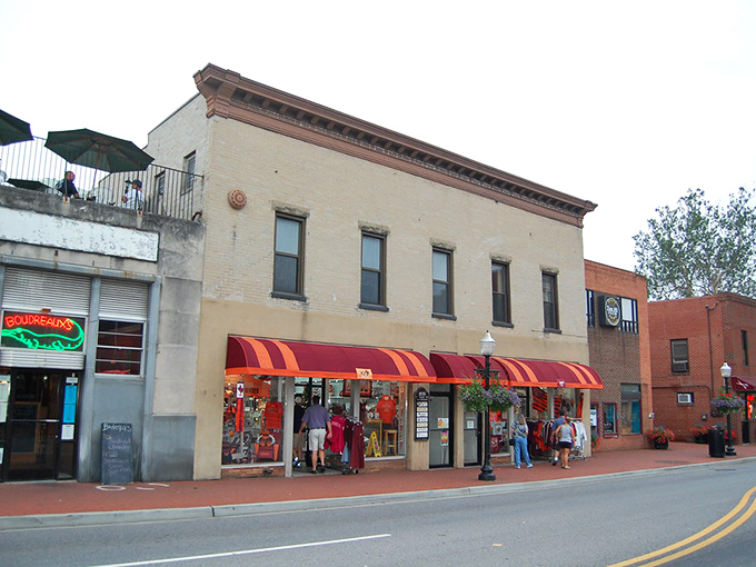 Red brick buildings stand like sentinels of history, watching over a town where past and present shake hands daily. 