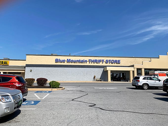 Blue Mountain's bold blue signage pops against the sky like a thrifter's North Star. Follow it to bargain bliss!
