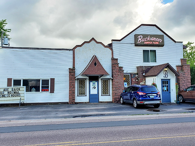 Buck-A-Neer's vintage sign glows with promise – no frills, just legendary steaks that locals drive miles to devour.
