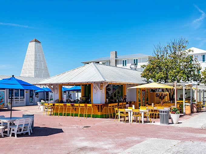 Beach-cottage charm with a gourmet twist! Bud & Alley's striped awnings offer a shady retreat for serious seafood enthusiasts.