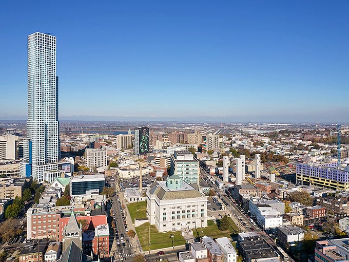 That flatiron-style building anchors the corner like it's been telling stories for a century - urban character personified!