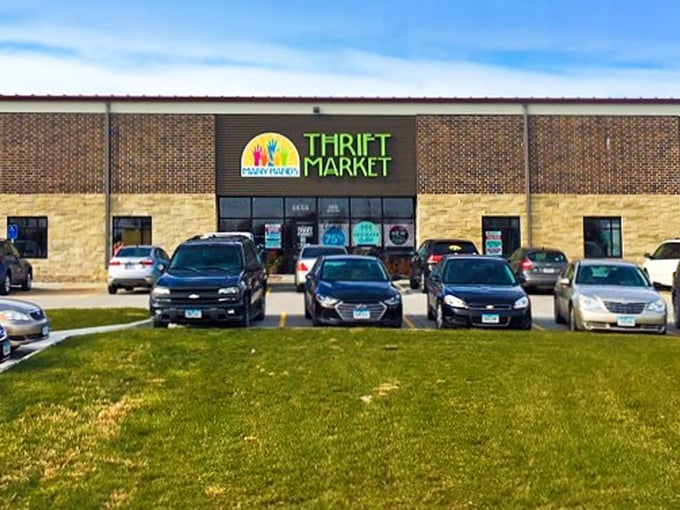 Many Hands Thrift Market elevates secondhand shopping with its clean storefront and colorful metal flower garden&mdash;beauty in recycled form.