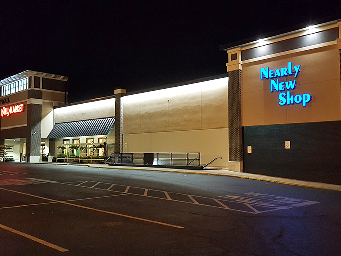 Nearly New Shop glows like a beacon for night owls, its blue signage promising upscale finds at thrift store prices.