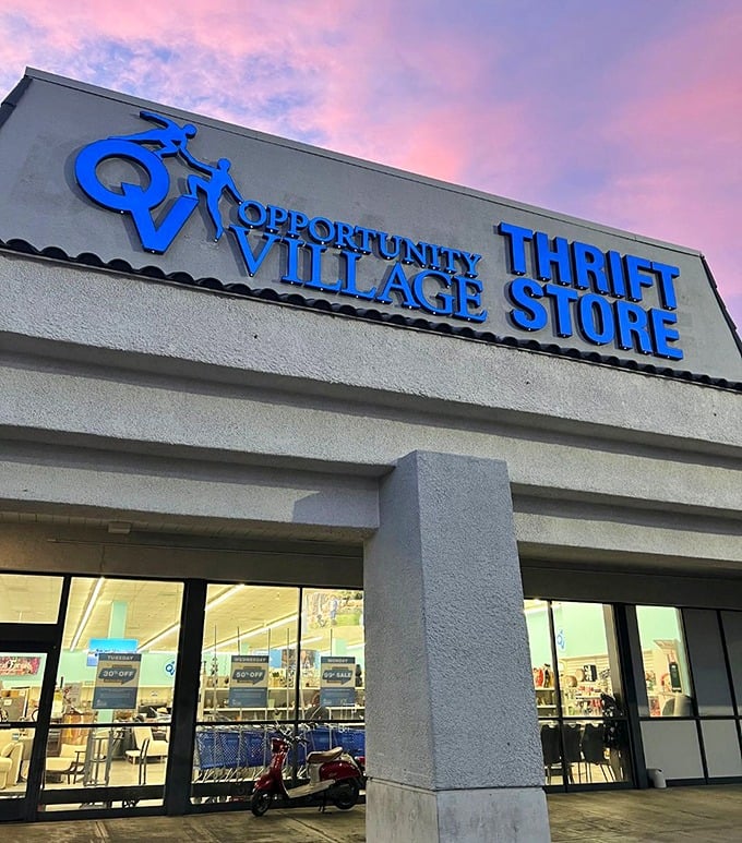 Opportunity Village glows with promise against a dreamy sunset sky. That blue sign practically sings "Come find your next conversation piece!"