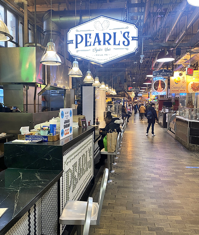Pearl's Oyster Bar gleams like a hidden treasure in Reading Terminal's bustling marketplace. A seafood oasis amid the market madness.