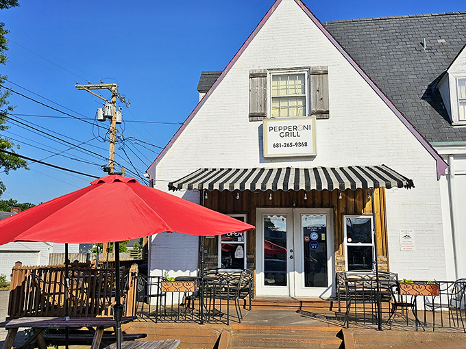 Pepperoni Grill's quaint white exterior and striped awning hide a pizza paradise that locals have treasured for years.