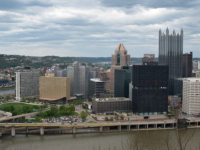 Pittsburgh's dramatic skyline rises majestically between its famous three rivers. Those gleaming towers look like they're playing a game of architectural one-upmanship.